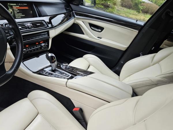 Black BMW 520 2015 in Riga, with an engine capacity of 2.00 L and mileage of 315 thousand km for 11890 €, photo 8 on AUTOMOTO.COM.LV