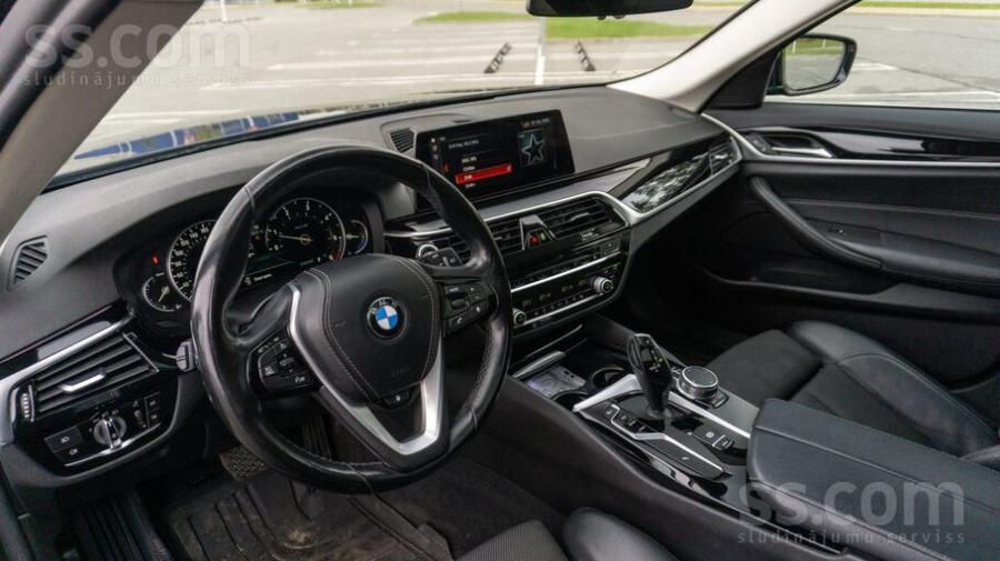 Black BMW 520 2018 in Riga, with an engine capacity of 2.00 L and mileage of 207 thousand km for 17990 €, photo 11 on AUTOMOTO.COM.LV