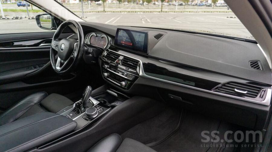 Black BMW 520 2018 in Riga, with an engine capacity of 2.00 L and mileage of 207 thousand km for 17990 €, photo 12 on AUTOMOTO.COM.LV
