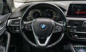 Black BMW 520 2018 in Riga, with an engine capacity of 2.00 L and mileage of 207 thousand km for 17990 €, photo 15 on AUTOMOTO.COM.LV
