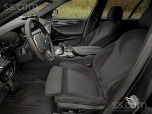 Black BMW 520 2020 in Riga, with an engine capacity of 2.00 L and mileage of 140 thousand km for 27500 €, photo 14 on AUTOMOTO.COM.LV