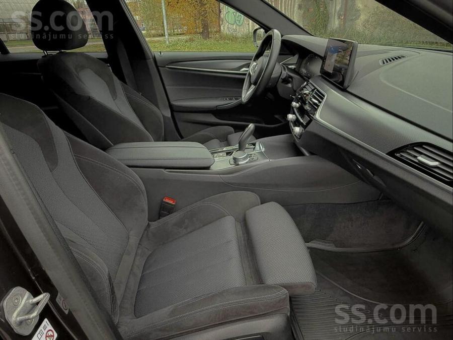 Black BMW 520 2020 in Riga, with an engine capacity of 2.00 L and mileage of 140 thousand km for 27500 €, photo 18 on AUTOMOTO.COM.LV