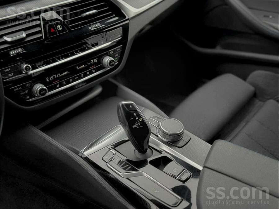 Black BMW 520 2020 in Riga, with an engine capacity of 2.00 L and mileage of 140 thousand km for 27500 €, photo 21 on AUTOMOTO.COM.LV