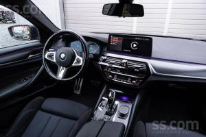 Black BMW 520 2021 in Jelgava, with an engine capacity of 2.00 L and mileage of 159 thousand km for 30700 €, photo 10 on AUTOMOTO.COM.LV