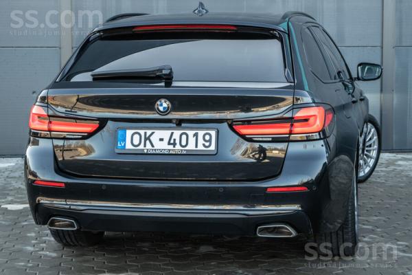 Black BMW 520 2021 in Riga, with an engine capacity of 2.00 L and mileage of 207 thousand km for 22870 €, photo 4 on AUTOMOTO.COM.LV