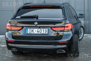 Black BMW 520 2021 in Riga, with an engine capacity of 2.00 L and mileage of 207 thousand km for 22870 €, photo 5 on AUTOMOTO.COM.LV