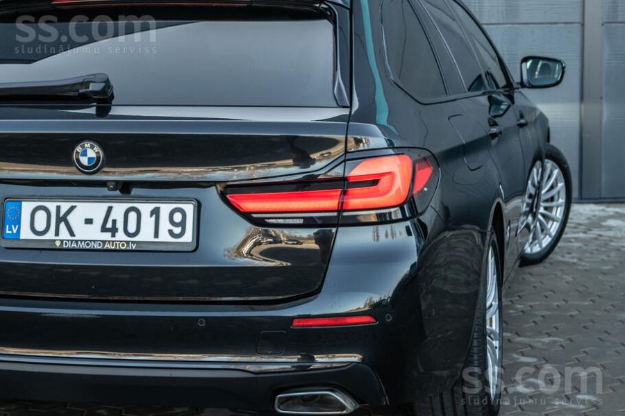Black BMW 520 2021 in Riga, with an engine capacity of 2.00 L and mileage of 207 thousand km for 22870 €, photo 15 on AUTOMOTO.COM.LV