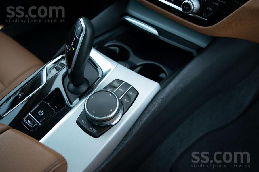 Black BMW 520 2021 in Riga, with an engine capacity of 2.00 L and mileage of 207 thousand km for 22870 €, photo 32 on AUTOMOTO.COM.LV