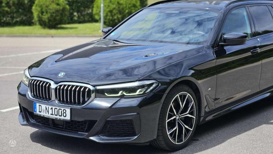 Black BMW 520 2021 in Elektrenai, with an engine capacity of 2.00 L and mileage of 192 thousand km for 24990 €, photo 12 on AUTOMOTO.COM.LV