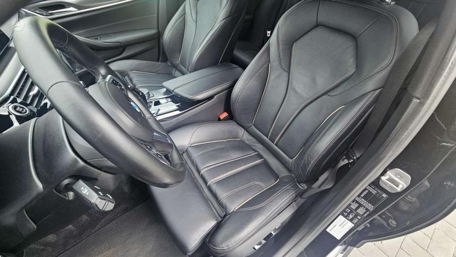 Black BMW 520 2021 in Elektrenai, with an engine capacity of 2.00 L and mileage of 192 thousand km for 24990 €, photo 14 on AUTOMOTO.COM.LV