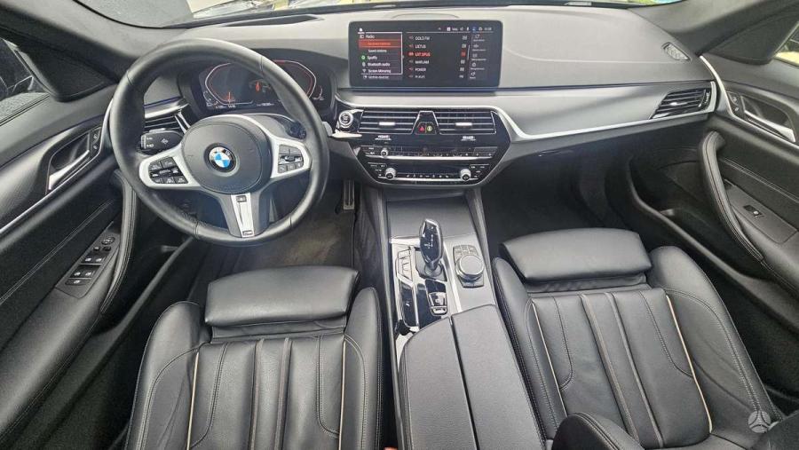 Black BMW 520 2021 in Elektrenai, with an engine capacity of 2.00 L and mileage of 192 thousand km for 24990 €, photo 15 on AUTOMOTO.COM.LV