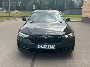 Black BMW 520 2021 in Riga, with an engine capacity of 2.00 L and mileage of 209 thousand km for 24000 €, photo 4 on AUTOMOTO.COM.LV