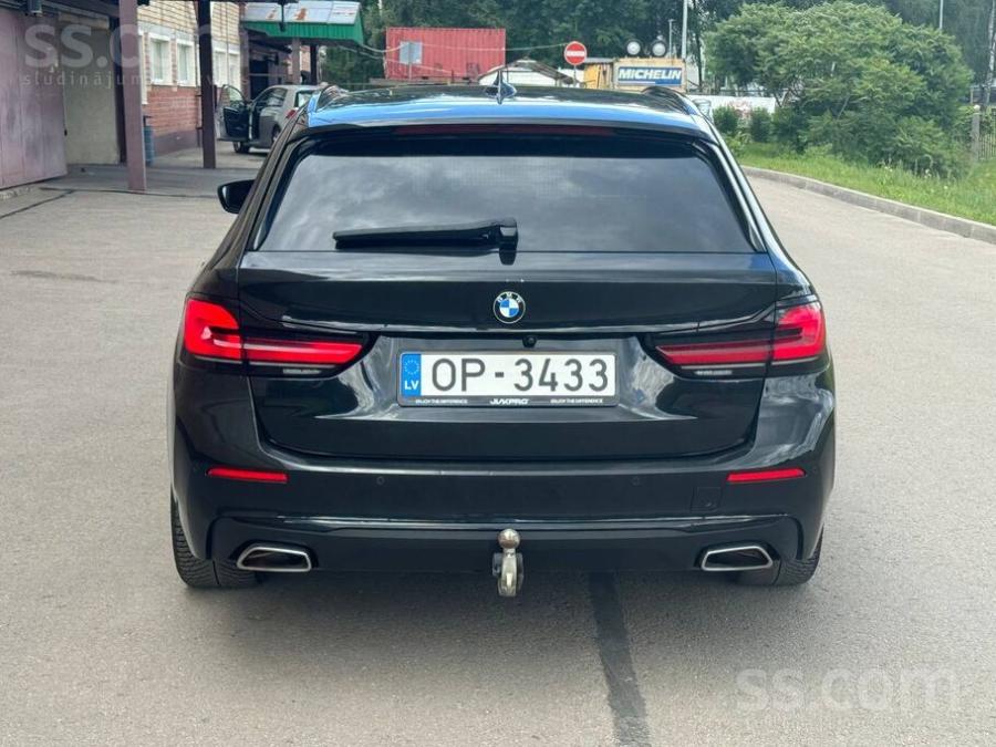 Black BMW 520 2021 in Riga, with an engine capacity of 2.00 L and mileage of 209 thousand km for 24000 €, photo 8 on AUTOMOTO.COM.LV