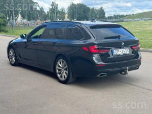 Black BMW 520 2021 in Riga, with an engine capacity of 2.00 L and mileage of 209 thousand km for 24000 €, photo 9 on AUTOMOTO.COM.LV