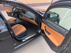 Black BMW 520 2021 in Riga, with an engine capacity of 2.00 L and mileage of 209 thousand km for 24000 €, photo 12 on AUTOMOTO.COM.LV