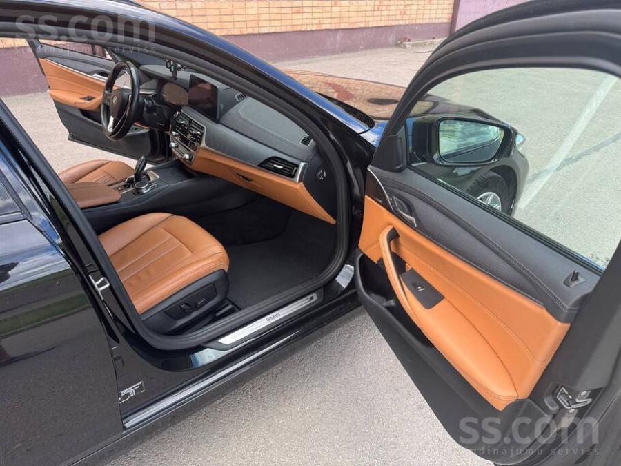 Black BMW 520 2021 in Riga, with an engine capacity of 2.00 L and mileage of 209 thousand km for 24000 €, photo 12 on AUTOMOTO.COM.LV
