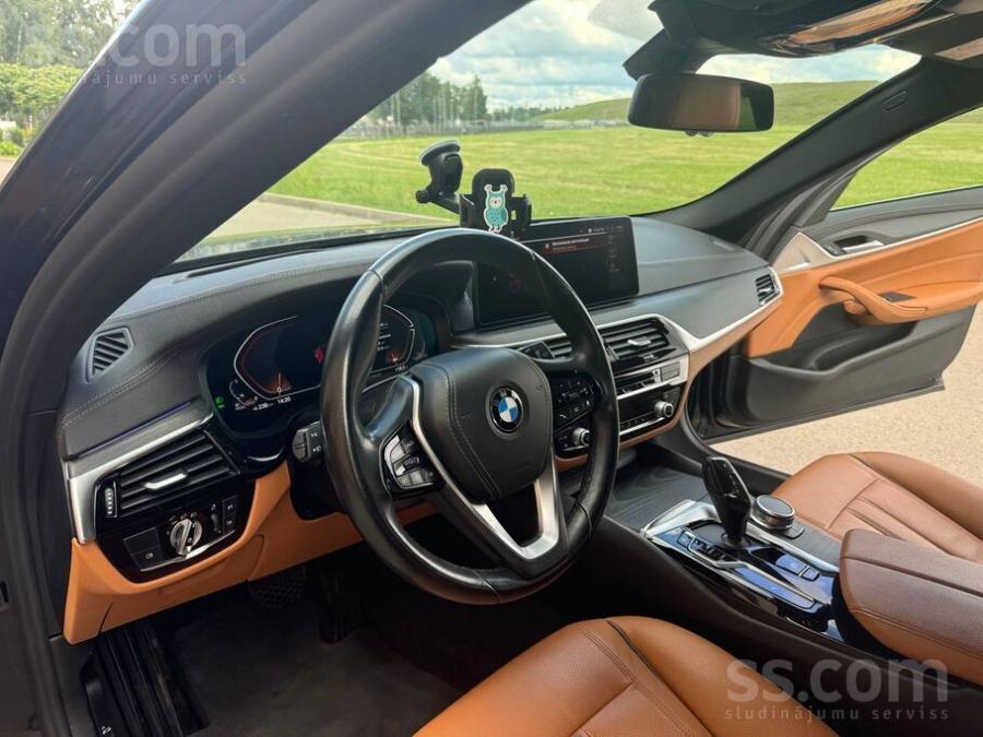 Black BMW 520 2021 in Riga, with an engine capacity of 2.00 L and mileage of 209 thousand km for 24000 €, photo 13 on AUTOMOTO.COM.LV