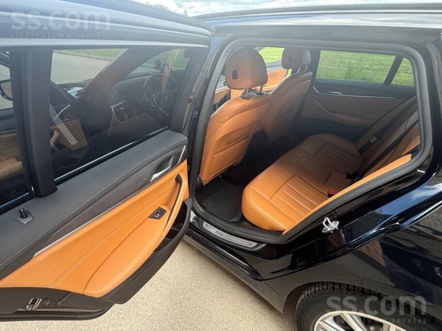 Black BMW 520 2021 in Riga, with an engine capacity of 2.00 L and mileage of 209 thousand km for 24000 €, photo 14 on AUTOMOTO.COM.LV