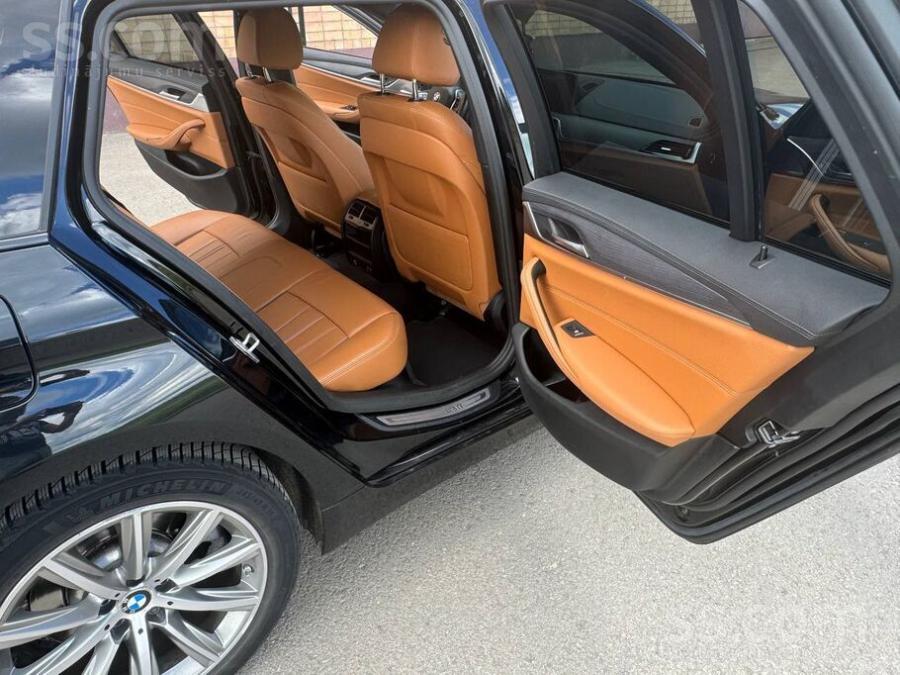 Black BMW 520 2021 in Riga, with an engine capacity of 2.00 L and mileage of 209 thousand km for 24000 €, photo 15 on AUTOMOTO.COM.LV