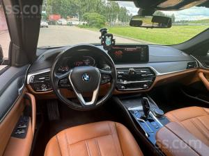 Black BMW 520 2021 in Riga, with an engine capacity of 2.00 L and mileage of 209 thousand km for 24000 €, photo 18 on AUTOMOTO.COM.LV