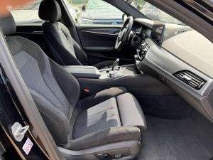 Black BMW 520 2021 in Vilnius, with an engine capacity of 2.00 L and mileage of 165 thousand km for 24600 €, photo 14 on AUTOMOTO.COM.LV