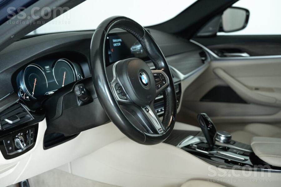 Blue BMW 520 2017 in Riga, with an engine capacity of 2.00 L and mileage of 217 thousand km for 18990 €, photo 23 on AUTOMOTO.COM.LV
