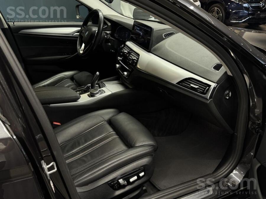 Grey BMW 520 2022 in Riga, with an engine capacity of 2.00 L and mileage of 212 thousand km for 23990 €, photo 13 on AUTOMOTO.COM.LV