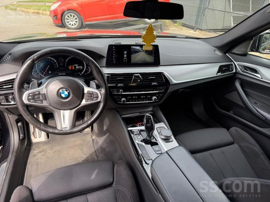 Black BMW 530 2017 in Riga, with an engine capacity of 3.00 L and mileage of 169 thousand km for 24990 €, photo 9 on AUTOMOTO.COM.LV