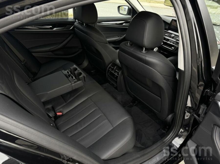 Black BMW 530 2018 in Riga, with an engine capacity of 3.00 L and mileage of 165 thousand km for 21490 €, photo 13 on AUTOMOTO.COM.LV