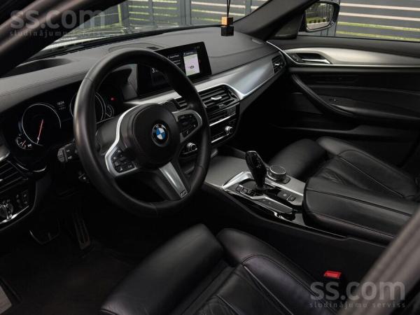 Black BMW 530 2018 in Riga, with an engine capacity of 2.00 L and mileage of 223 thousand km for 28450 €, photo 10 on AUTOMOTO.COM.LV