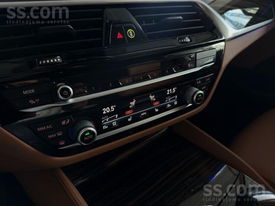 White BMW 530 2021 in Riga, with an engine capacity of 3.00 L and mileage of 83 thousand km for 35900 €, photo 19 on AUTOMOTO.COM.LV