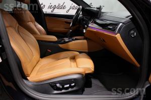 Black BMW 550 2021 in Riga, with an engine capacity of 4.40 L and mileage of 104 thousand km for 48490 €, photo 24 on AUTOMOTO.COM.LV