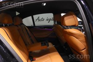 Black BMW 550 2021 in Riga, with an engine capacity of 4.40 L and mileage of 104 thousand km for 48490 €, photo 26 on AUTOMOTO.COM.LV