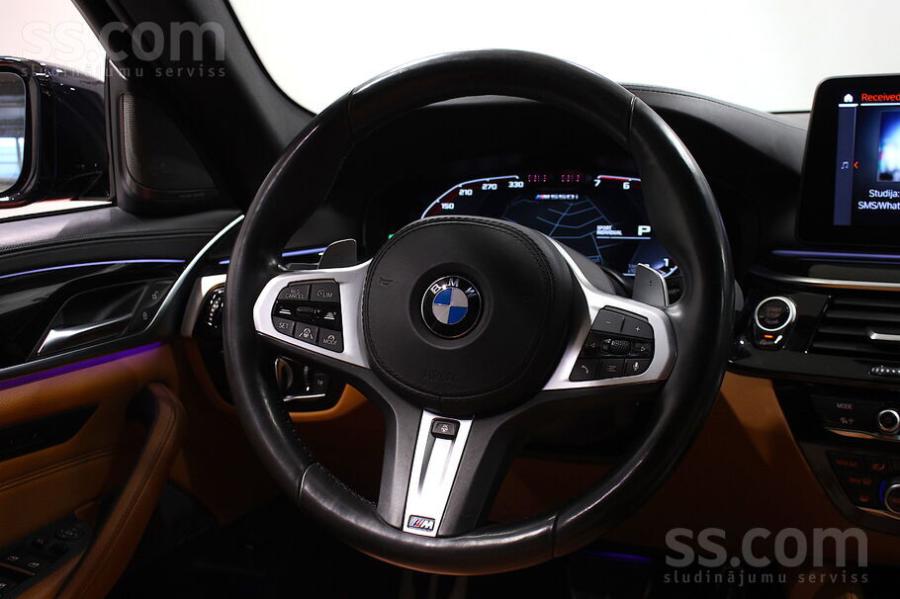 Black BMW 550 2021 in Riga, with an engine capacity of 4.40 L and mileage of 104 thousand km for 48490 €, photo 28 on AUTOMOTO.COM.LV