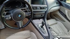 Black BMW 6 Series 2012 in Tallinn, with an engine capacity of 3.00 L and mileage of 305 thousand km for 18500 €, photo 23 on AUTOMOTO.COM.LV