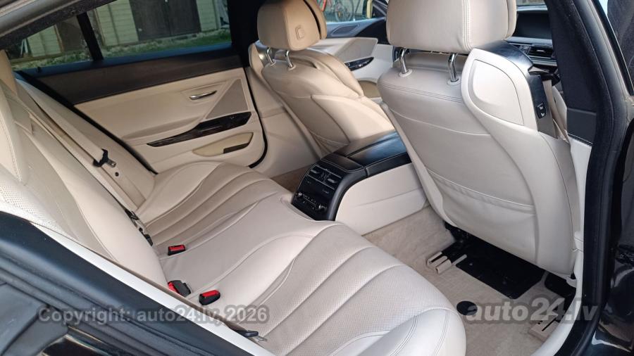 Black BMW 6 Series 2012 in Tallinn, with an engine capacity of 3.00 L and mileage of 305 thousand km for 18500 €, photo 25 on AUTOMOTO.COM.LV