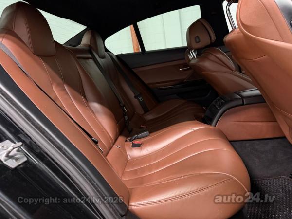Black BMW 6 Series 2013 in Tallinn, with an engine capacity of 3.00 L and mileage of 293 thousand km for 17999 €, photo 10 on AUTOMOTO.COM.LV