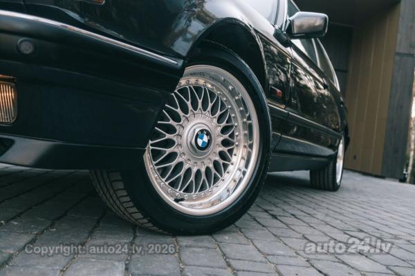 Black BMW 7 Series 1994 in Tallinn, with an engine capacity of 5.00 L and mileage of 217 thousand km for 13499 €, photo 7 on AUTOMOTO.COM.LV