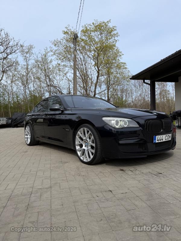 Black BMW 7 Series 2011 in Tallinn, with an engine capacity of 3.00 L and mileage of 220 thousand km for 13999 €, photo 2 on AUTOMOTO.COM.LV