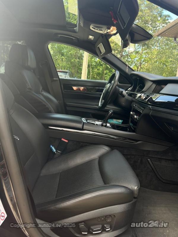 Black BMW 7 Series 2011 in Tallinn, with an engine capacity of 3.00 L and mileage of 220 thousand km for 13999 €, photo 8 on AUTOMOTO.COM.LV