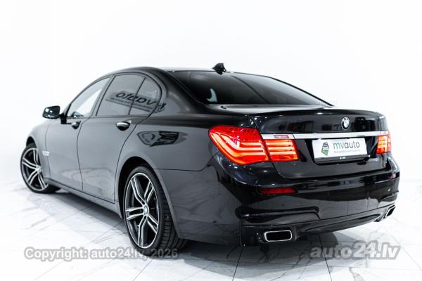 Black BMW 7 Series 2011 in Tallinn, with an engine capacity of 3.00 L and mileage of 266 thousand km for 11990 €, photo 6 on AUTOMOTO.COM.LV