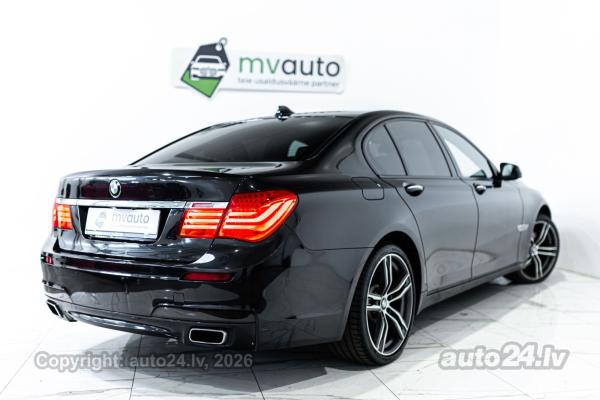 Black BMW 7 Series 2011 in Tallinn, with an engine capacity of 3.00 L and mileage of 266 thousand km for 11990 €, photo 8 on AUTOMOTO.COM.LV
