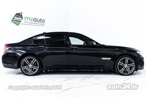 Black BMW 7 Series 2011 in Tallinn, with an engine capacity of 3.00 L and mileage of 266 thousand km for 11990 €, photo 10 on AUTOMOTO.COM.LV