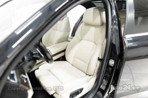 Black BMW 7 Series 2012 in Tallinn, with an engine capacity of 3.00 L and mileage of 217 thousand km for 15990 €, photo 12 on AUTOMOTO.COM.LV
