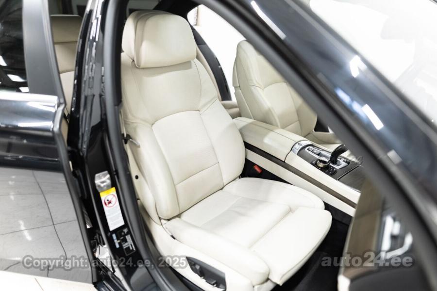 Black BMW 7 Series 2012 in Tallinn, with an engine capacity of 3.00 L and mileage of 217 thousand km for 15990 €, photo 14 on AUTOMOTO.COM.LV