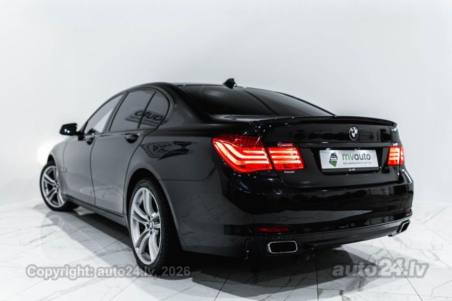 Black BMW 7 Series 2012 in Tallinn, with an engine capacity of 3.00 L and mileage of 239 thousand km for 11990 €, photo 7 on AUTOMOTO.COM.LV