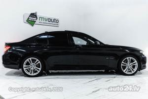 Black BMW 7 Series 2012 in Tallinn, with an engine capacity of 3.00 L and mileage of 239 thousand km for 11990 €, photo 10 on AUTOMOTO.COM.LV