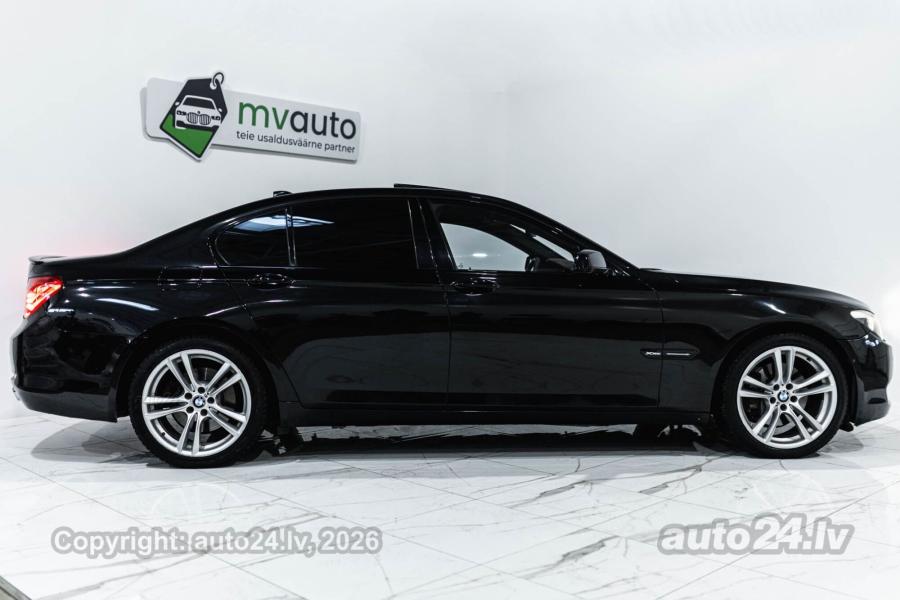Black BMW 7 Series 2012 in Tallinn, with an engine capacity of 3.00 L and mileage of 239 thousand km for 11990 €, photo 10 on AUTOMOTO.COM.LV