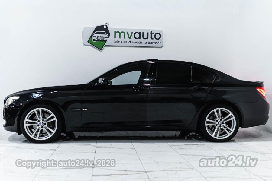Black BMW 7 Series 2012 in Tallinn, with an engine capacity of 3.00 L and mileage of 239 thousand km for 11990 €, photo 11 on AUTOMOTO.COM.LV