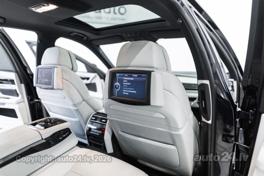 Black BMW 7 Series 2012 in Tallinn, with an engine capacity of 3.00 L and mileage of 240 thousand km for 12990 €, photo 17 on AUTOMOTO.COM.LV